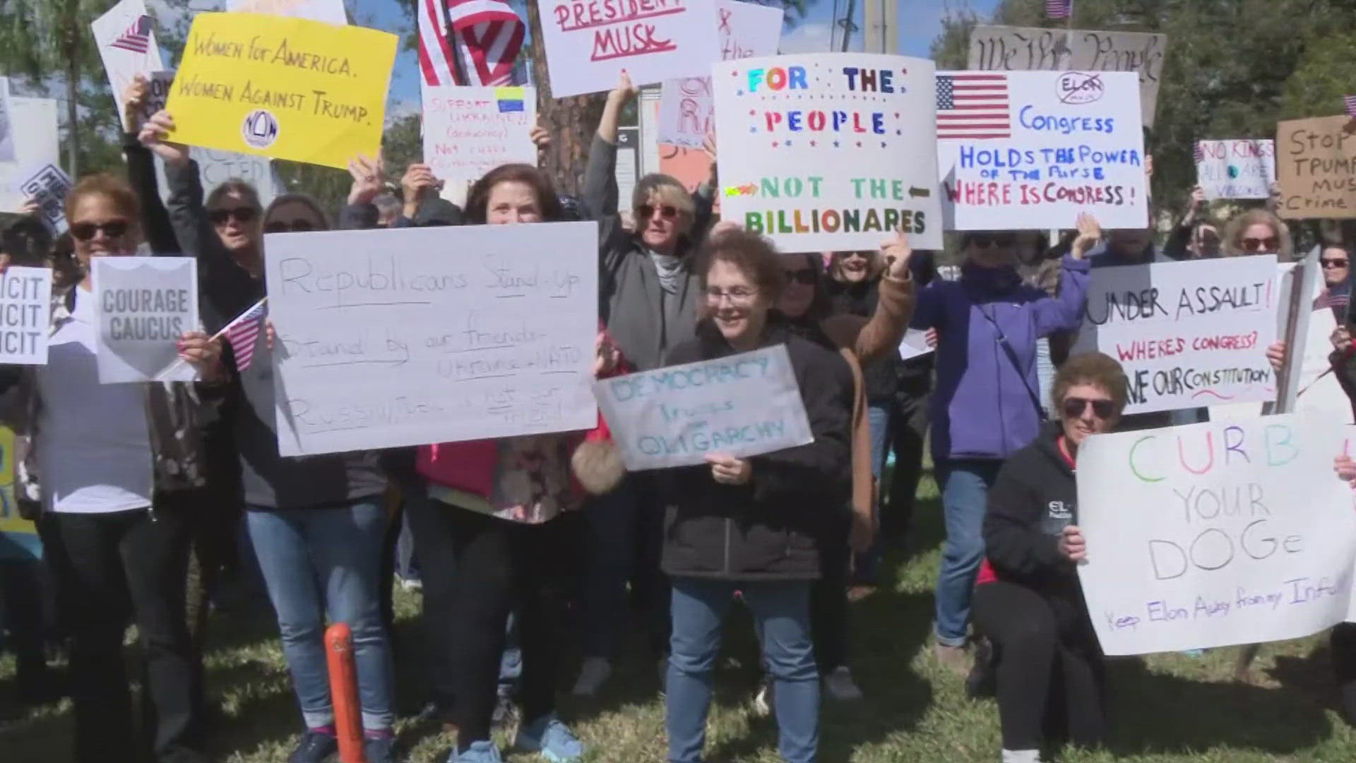 Protesters met with locked door at John Rutherford's office ...
