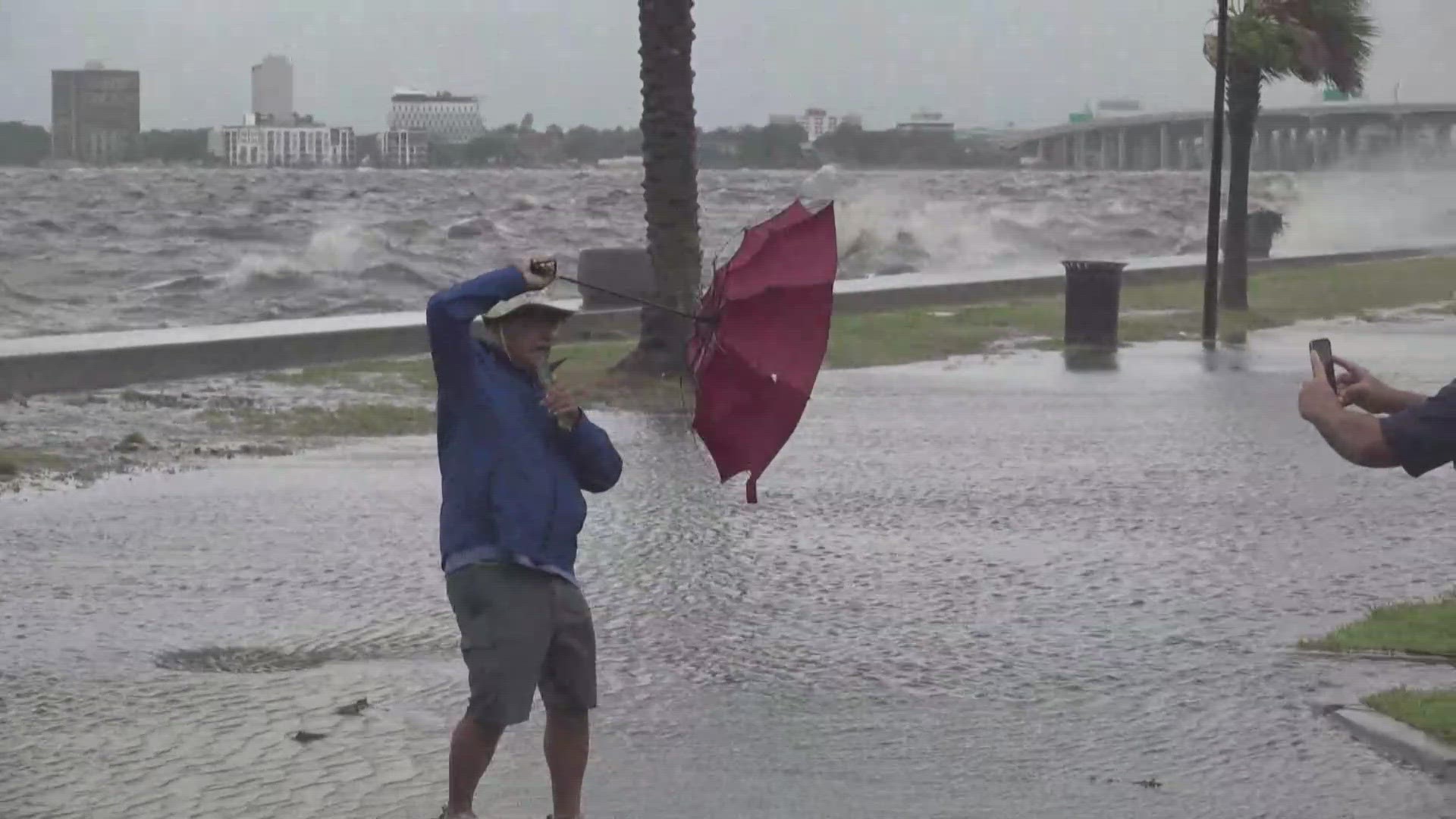 Florida man poses in front of flooding in San Marco park ...