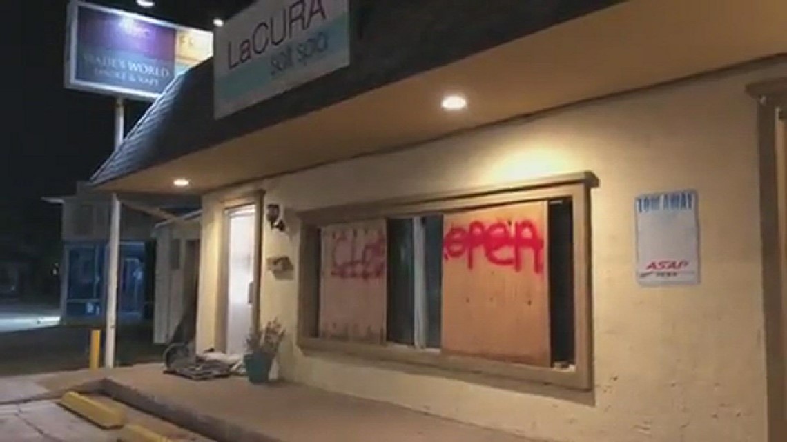 Flood water mark visible on boarded up businesses on A1A ...