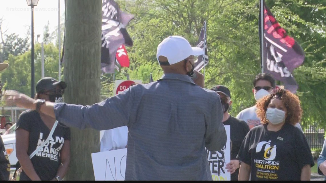 Protestors come out to support teacher removed from class after posting ...