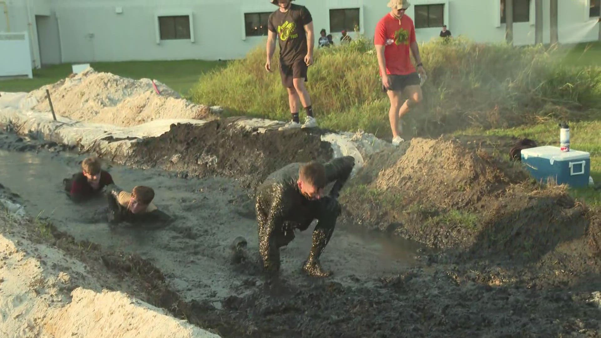 Navy sailors crawl through mud pit at annual Mayport Mud Run in ...