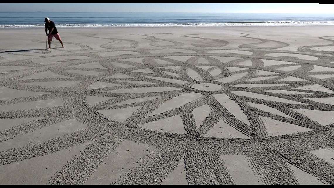 'We need you:' Florida artist inspires with giant sand designs ...