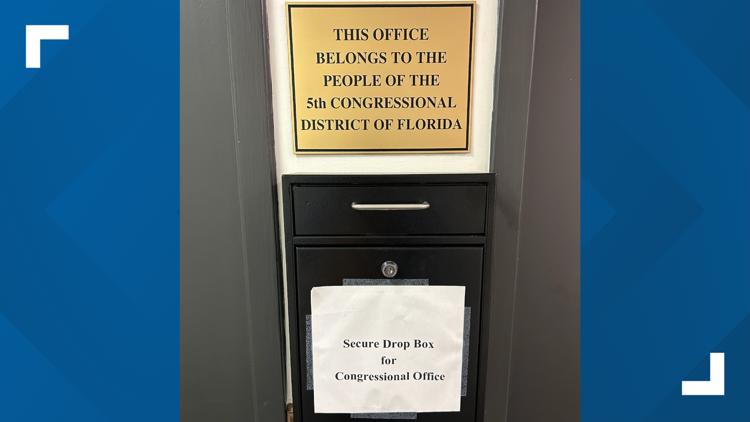 Protesters met with locked door at John Rutherford's office ...