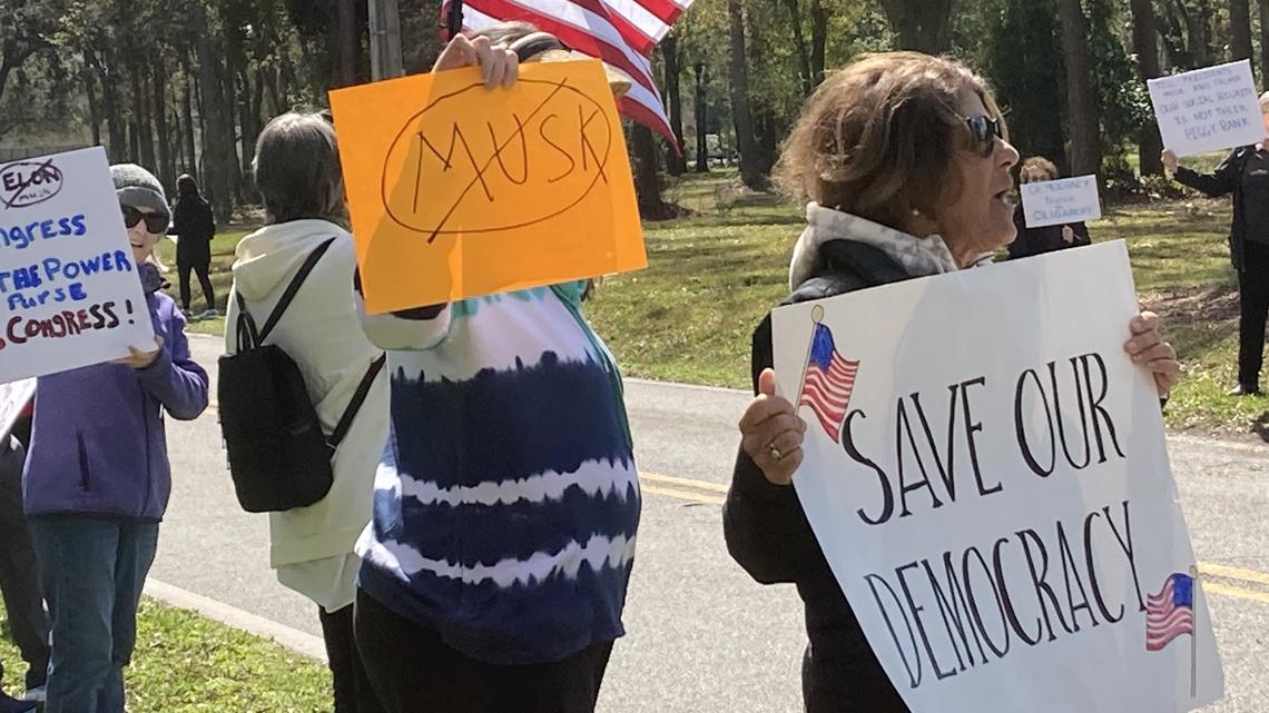 Protesters met with locked door at John Rutherford's office ...