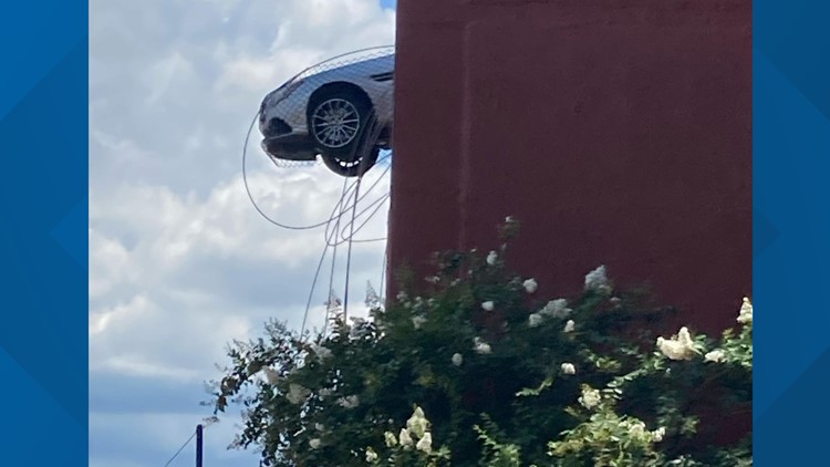 Photos: Car spotted dangling from parking garage in North Fla ...