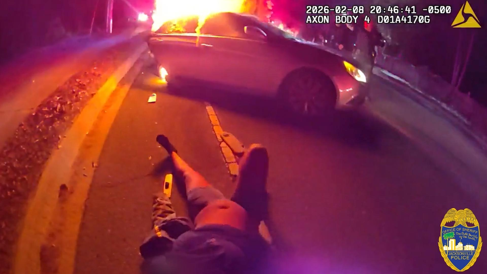 WATCH: Officer pulls woman from burning car after reported carjacking ...
