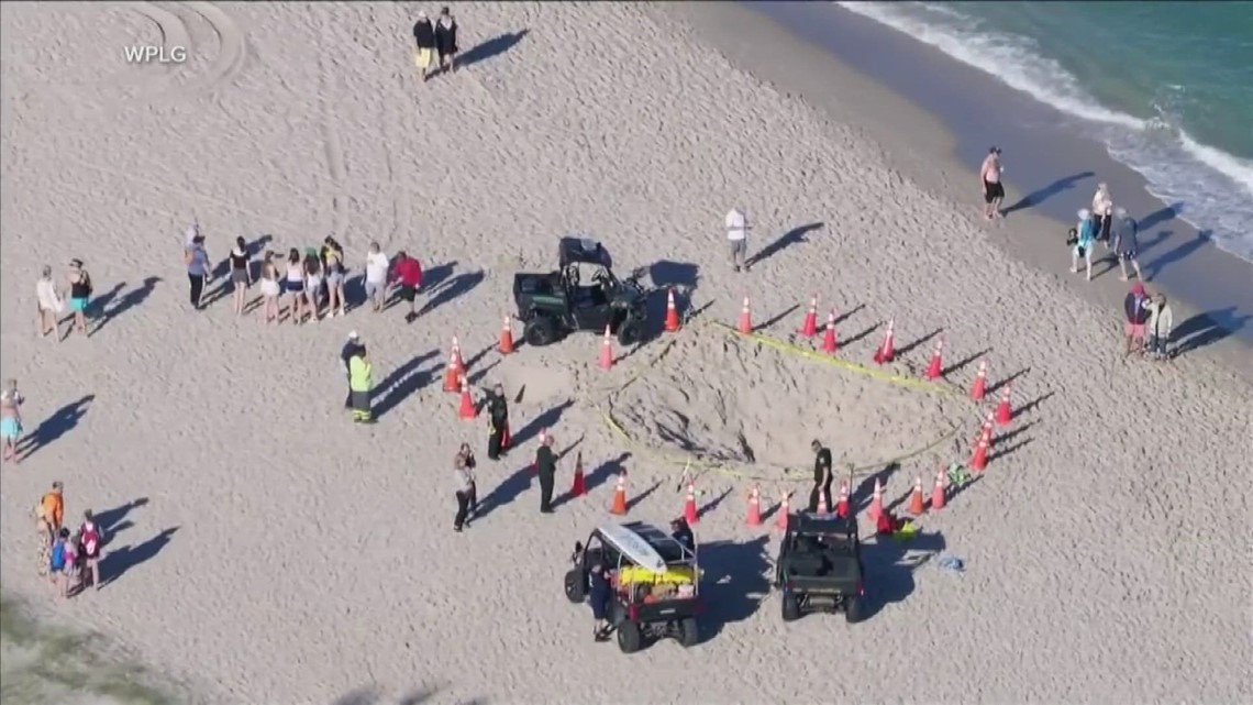 Young girl killed when a hole she dug in the sand collapsed on a ...