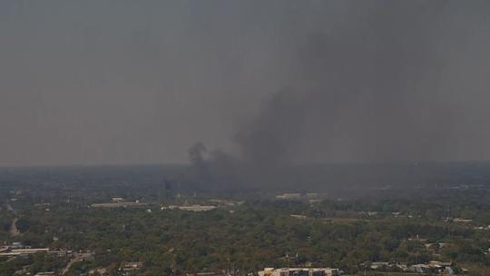Junkyard car fire causes massive plume of smoke west of Downtown ...