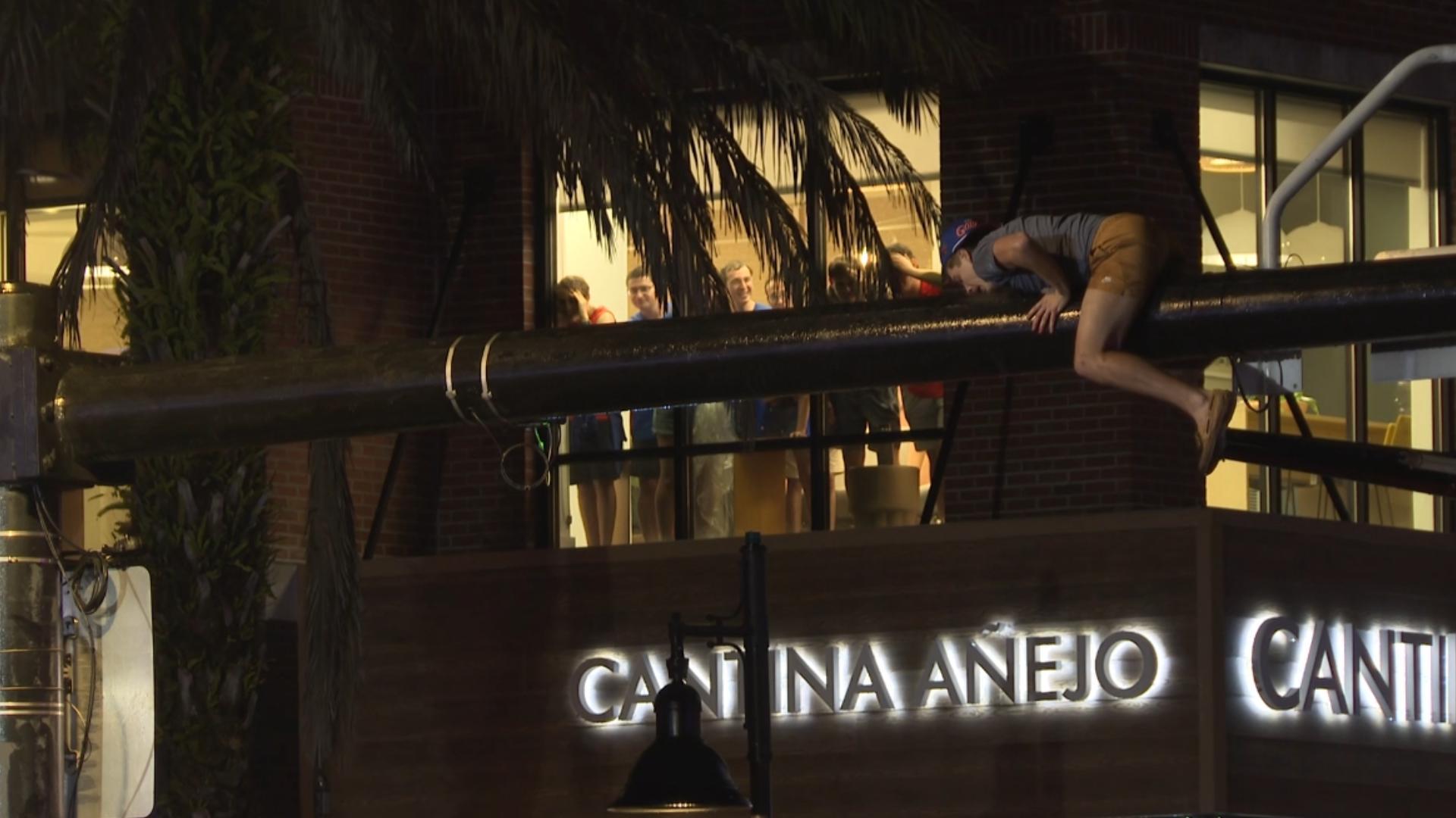 Florida Gators fan tumbles from traffic light during NCAA celebration ...