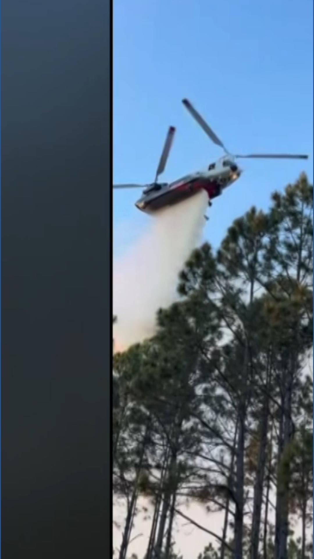 Helicopter dumps water over massive wildfire at Florida-Georgia state ...