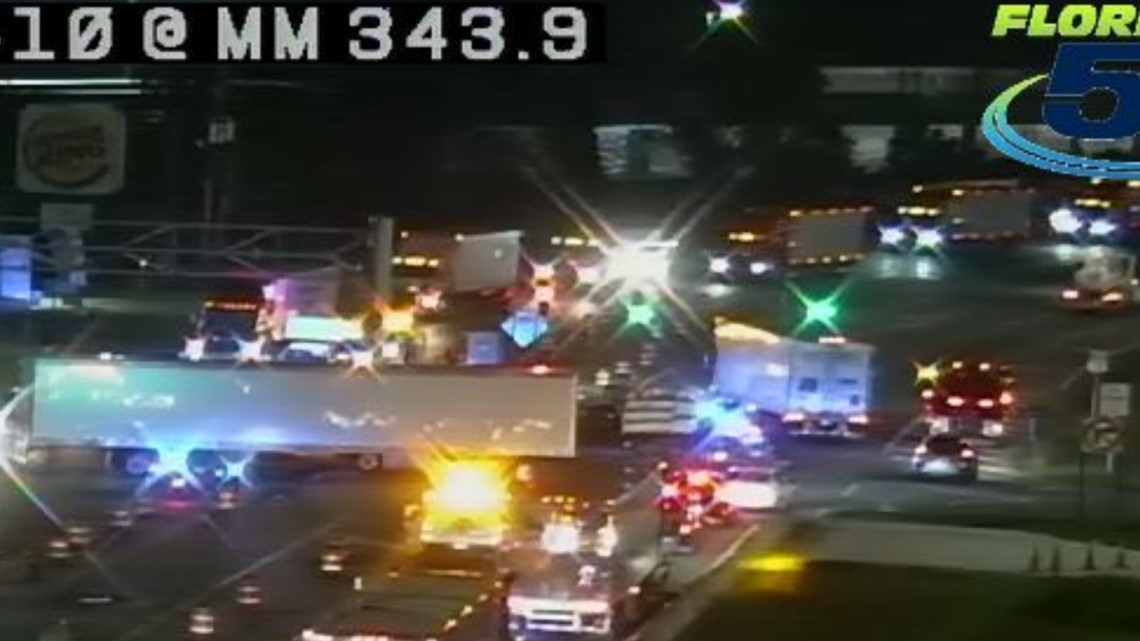 Tractor trailer crashes, lets out bees on I-10 | firstcoastnews.com
